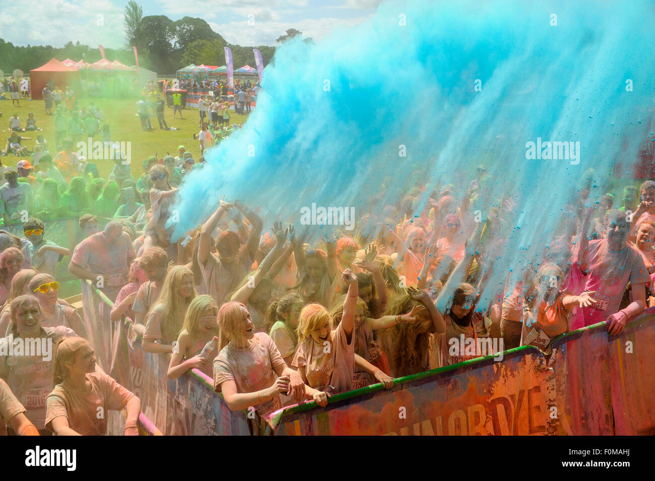 Fun-run audience covered in blue powder at Run or Dye 5k run Stock ...