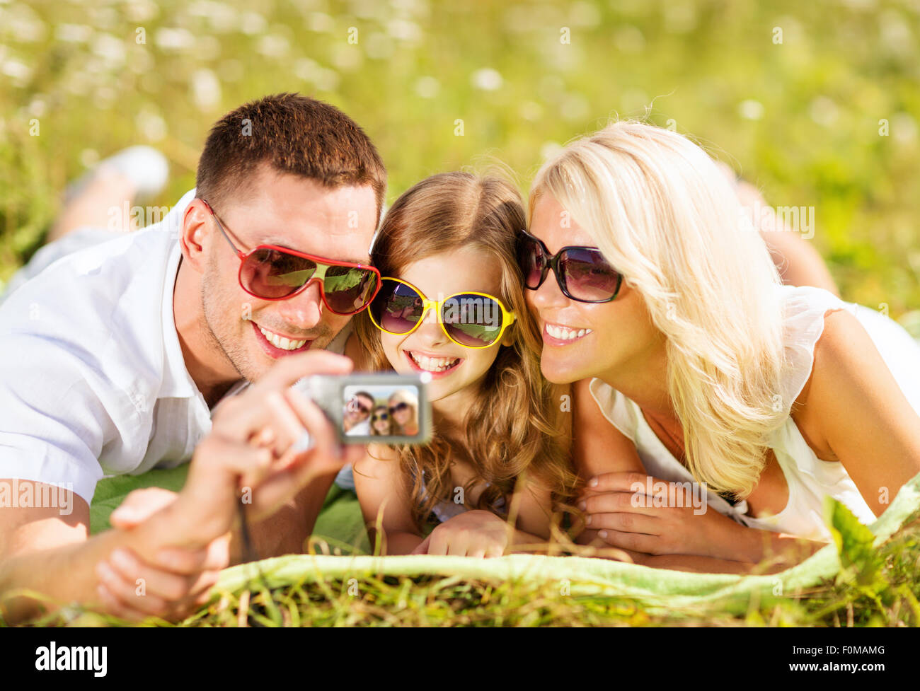 happy family with camera taking picture Stock Photo - Alamy