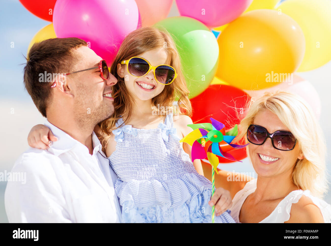 family with colorful balloons Stock Photo - Alamy