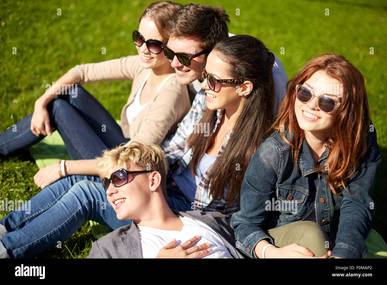 group of students or teenagers hanging out Stock Photo - Alamy