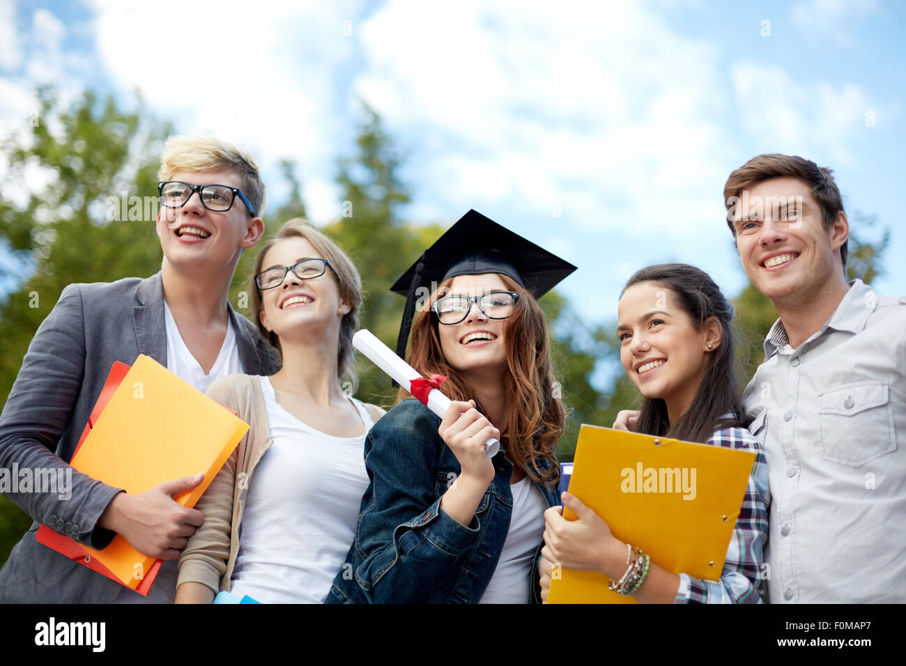 group of smiling students with diploma and folders Stock Photo - Alamy group of smiling students with diploma and folders Stock Photo - Alamy