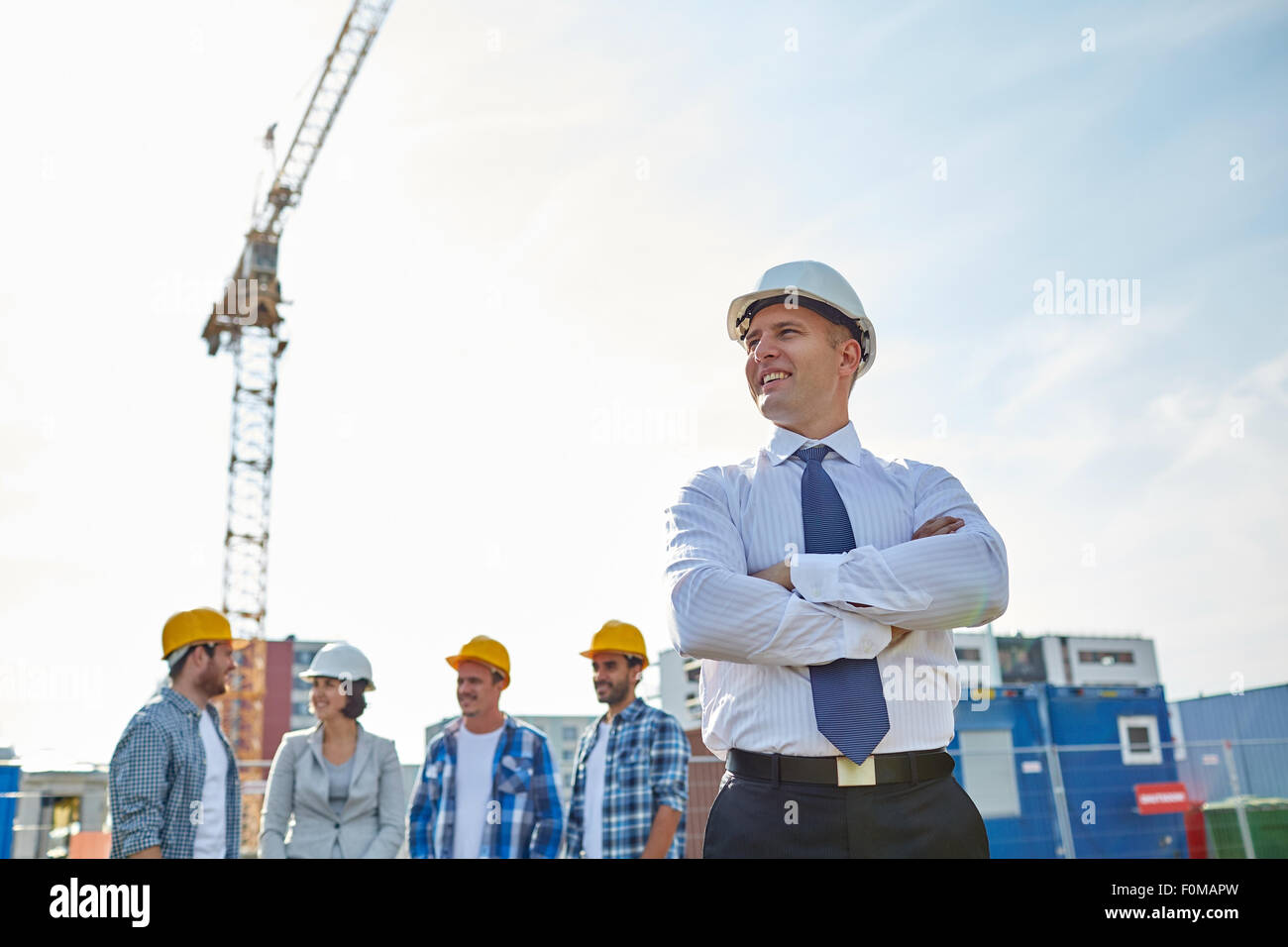 happy builders and architect at construction site Stock Photo - Alamy