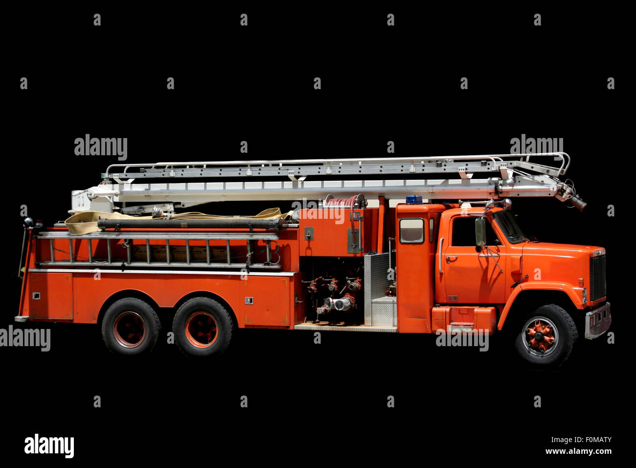 Fire engine isolated on a black background Stock Photo - Alamy