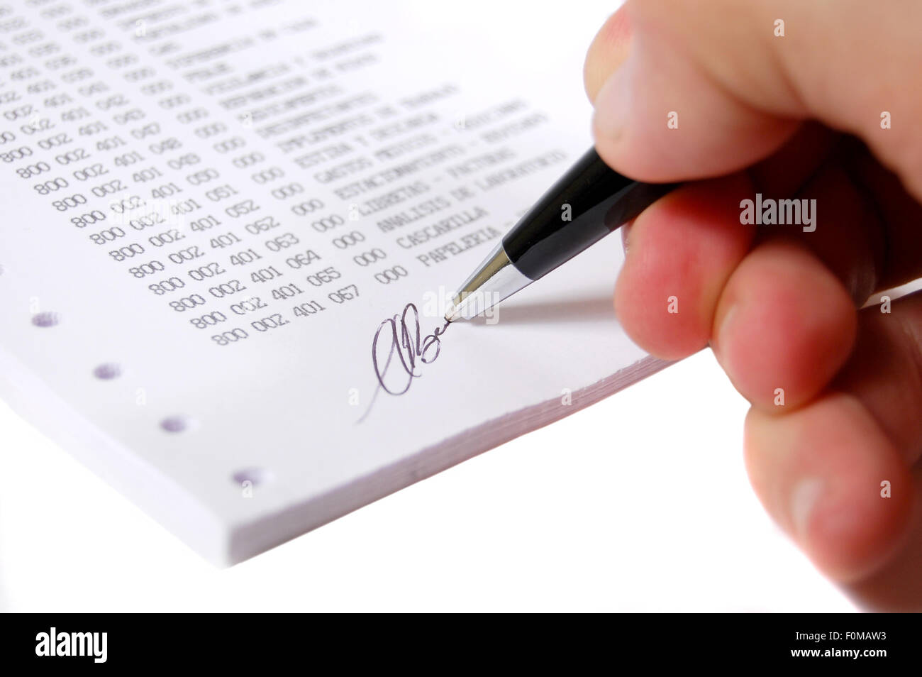 Hand with a pen signing a business paper Stock Photo - Alamy