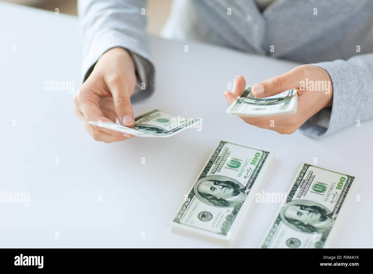 Woman counting money hands hi-res stock photography and images - Alamy