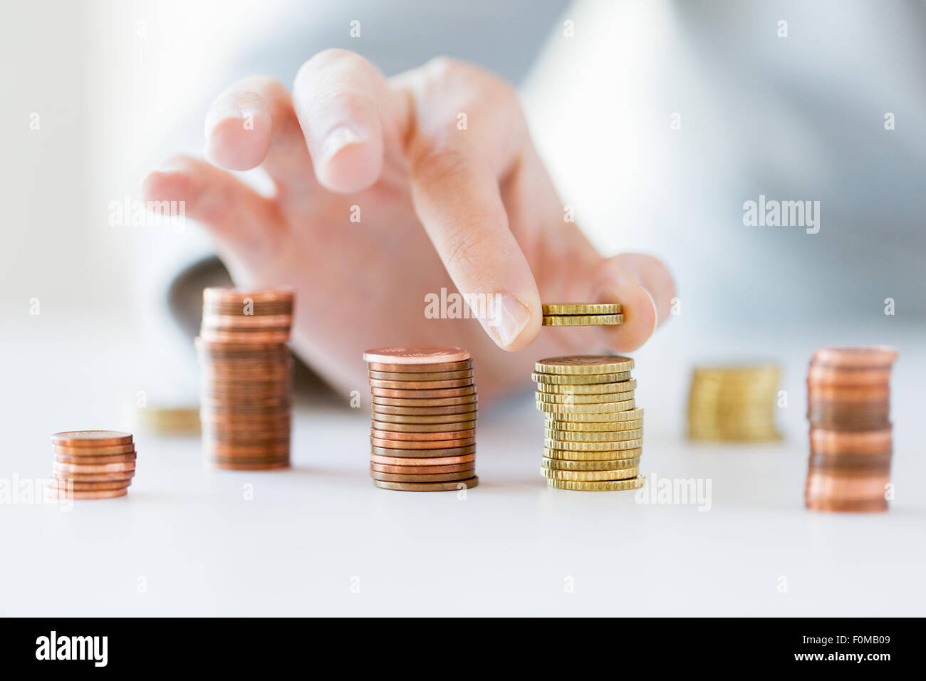 Hand sorting coins hi-res stock photography and images - Alamy