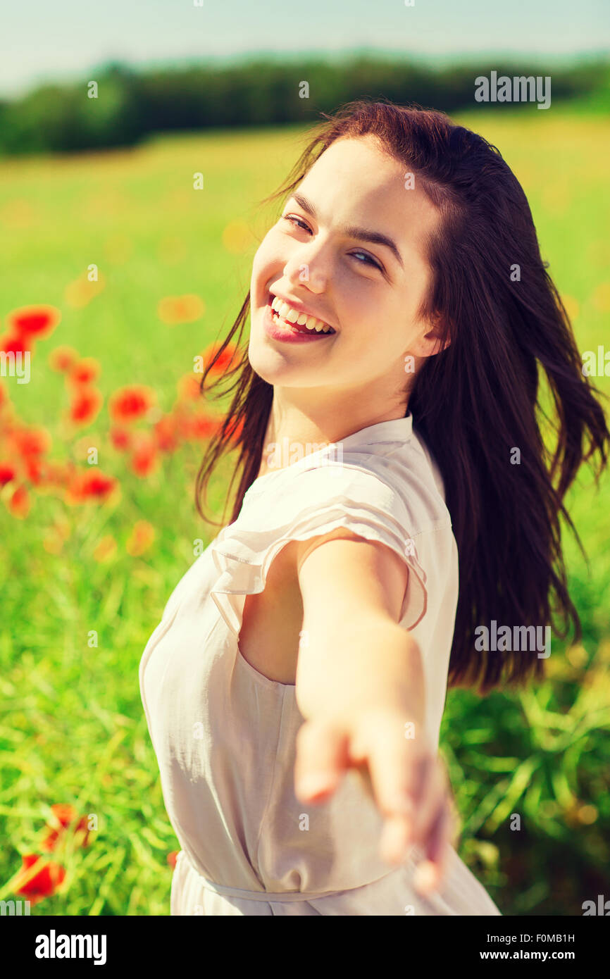 laughing young woman on poppy field Stock Photo - Alamy