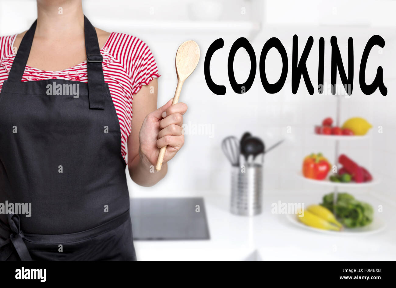 cooking cook holding wooden spoon background Stock Photo - Alamy