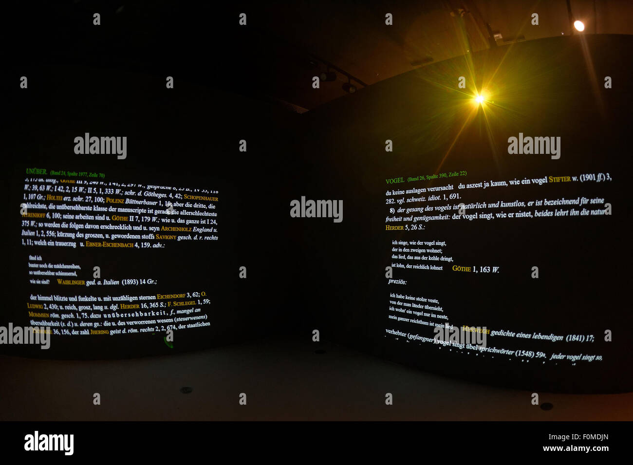 A three-channel video projection showing a random selection out of ...