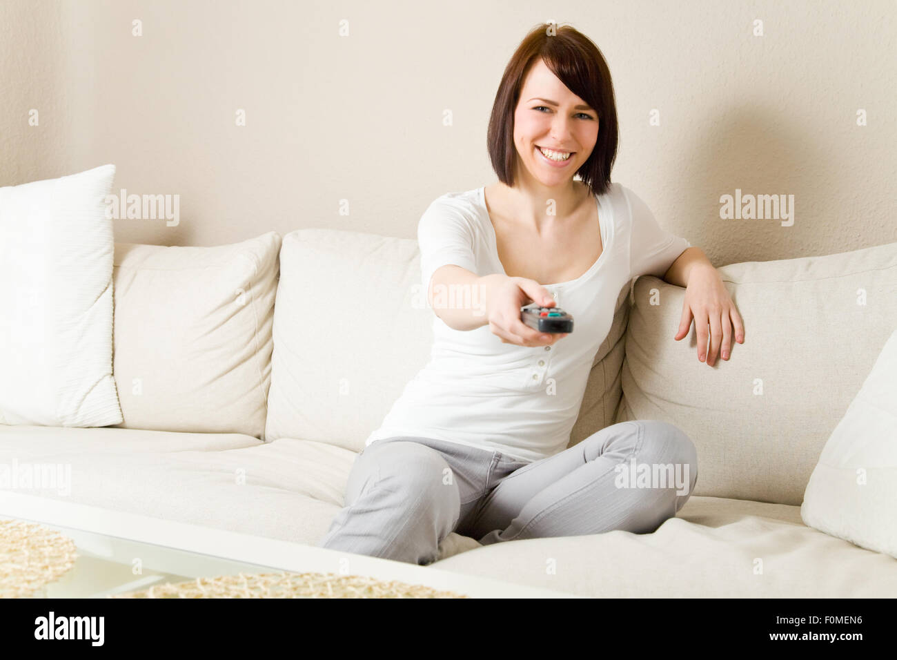 Woman television remote control hi-res stock photography and images - Alamy