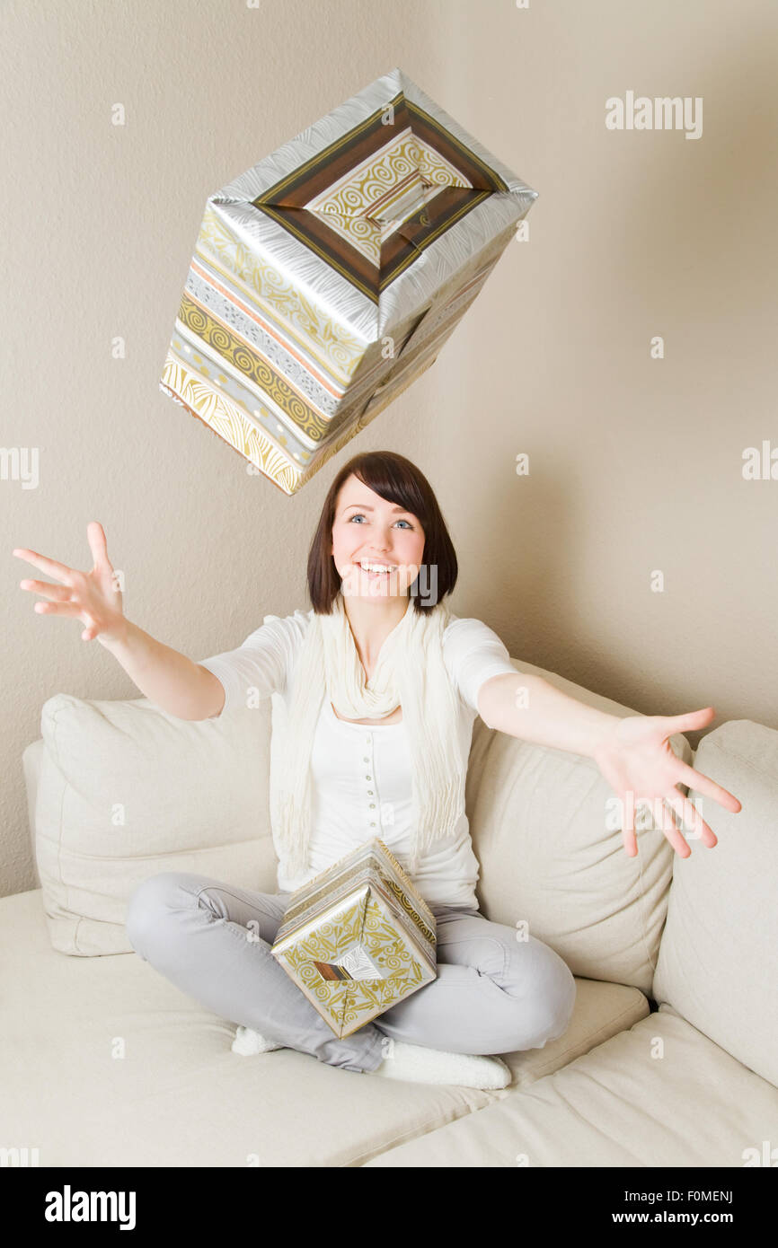 Woman catching christmas gift boxes hi-res stock photography and images ...