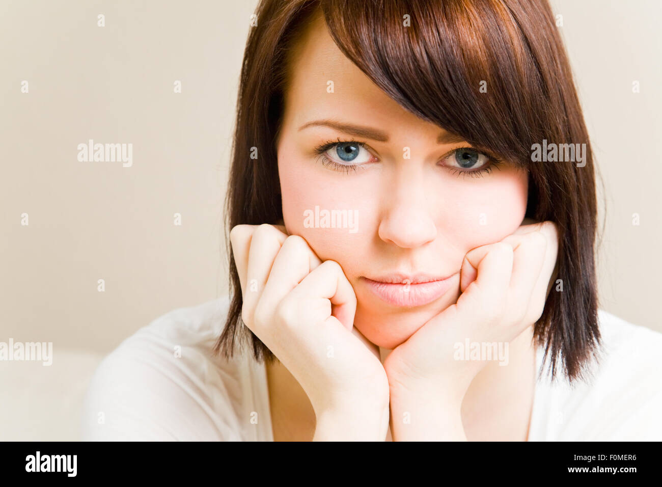 Young woman thinking and worrying Stock Photo - Alamy