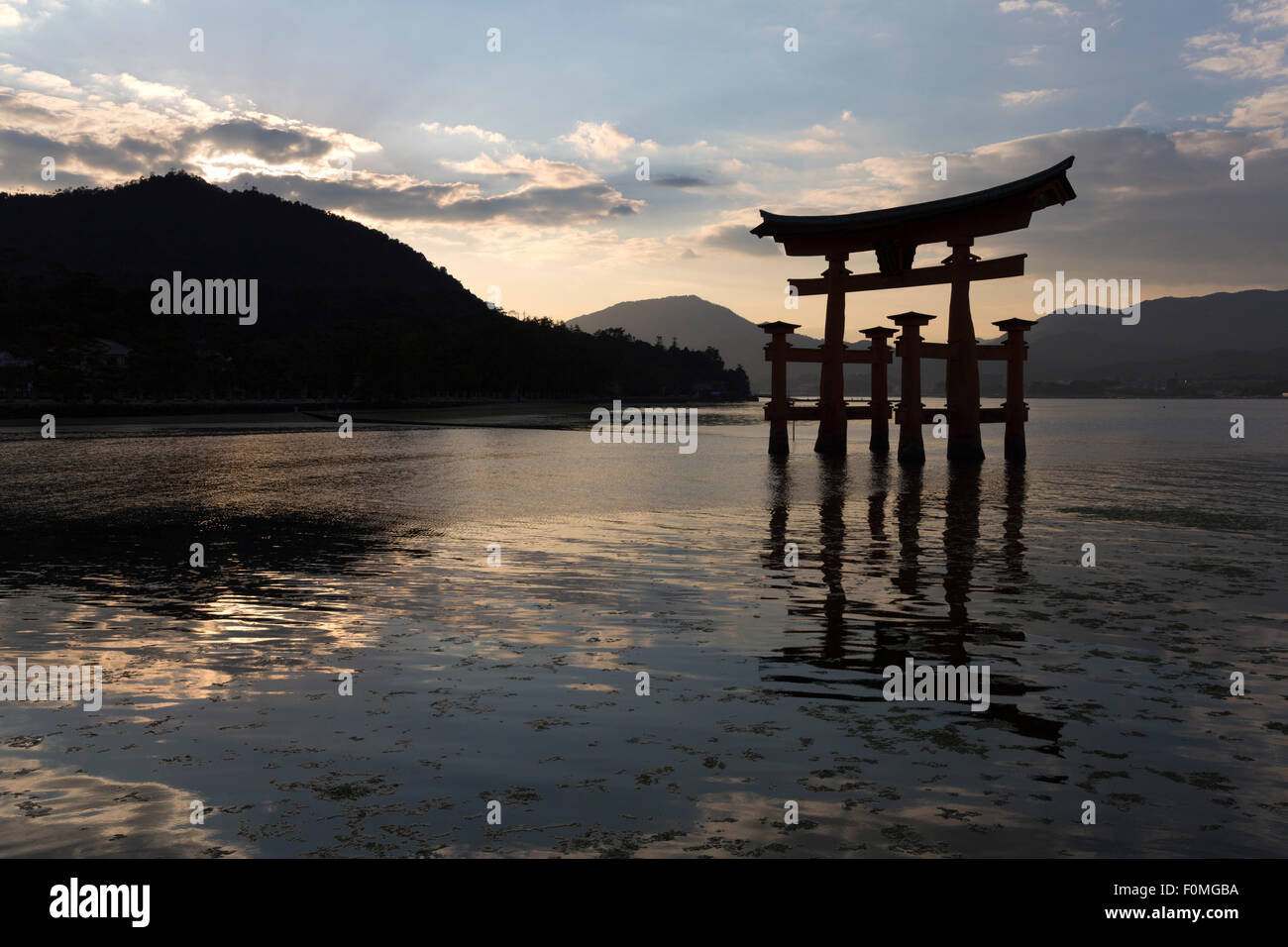 The floating Miyajima torii gate of Itsukushima Shrine at sunset ...