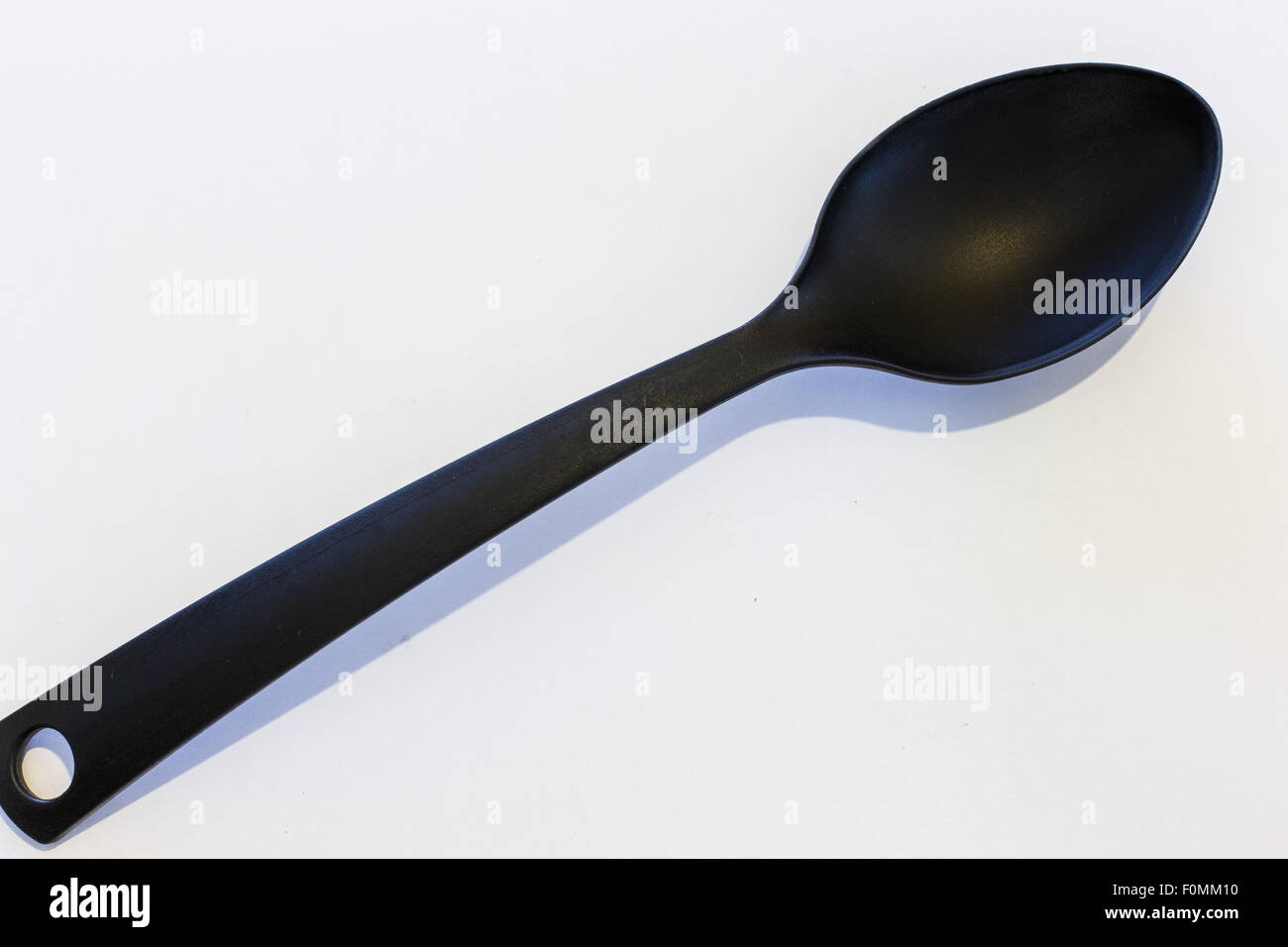 black Spoon isolated Stock Photo - Alamy