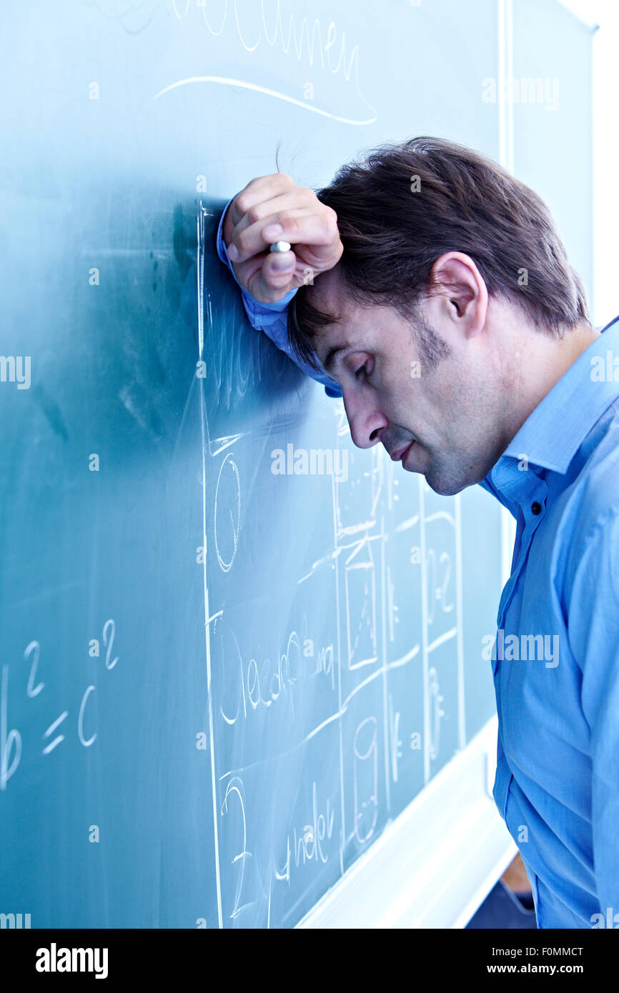 Stressed teacher in class hi-res stock photography and images - Alamy