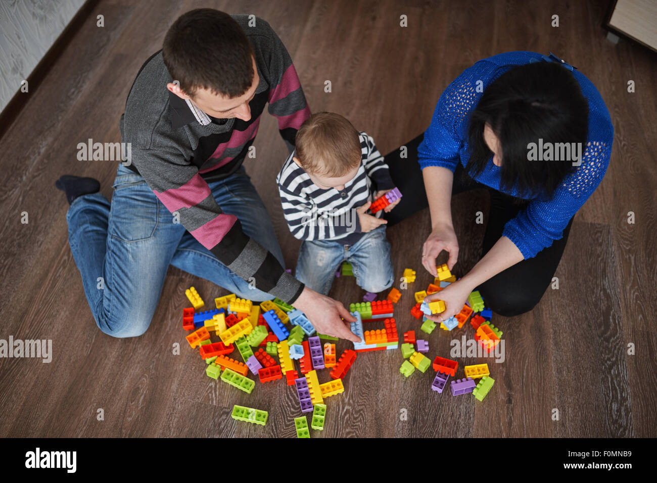 happy family play with cubes Stock Photo - Alamy