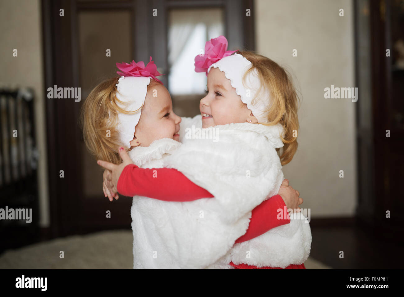 two cute twin girls Stock Photo - Alamy