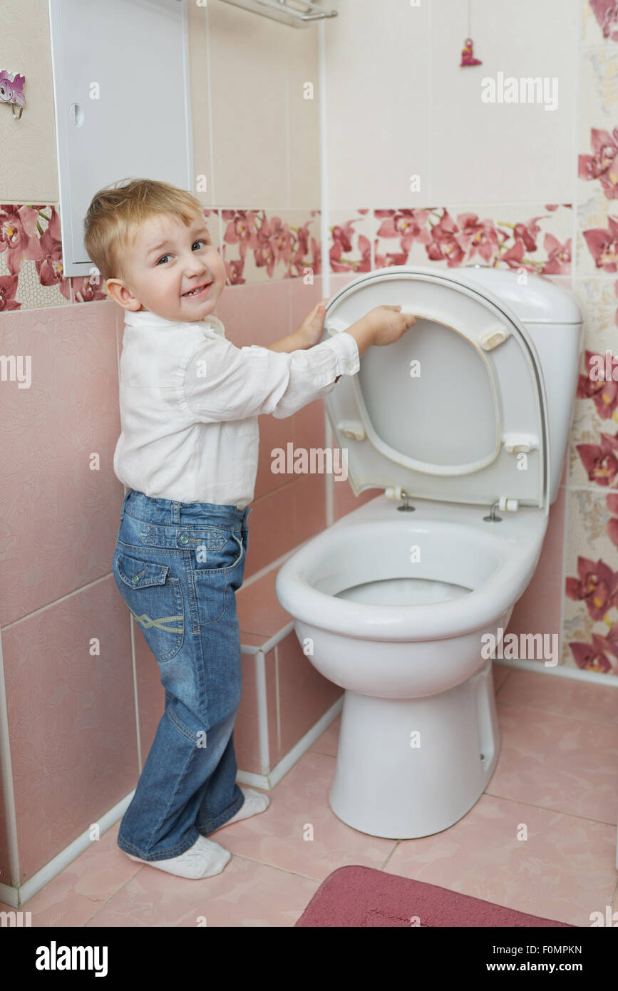 little boy looks in toilet Stock Photo - Alamy