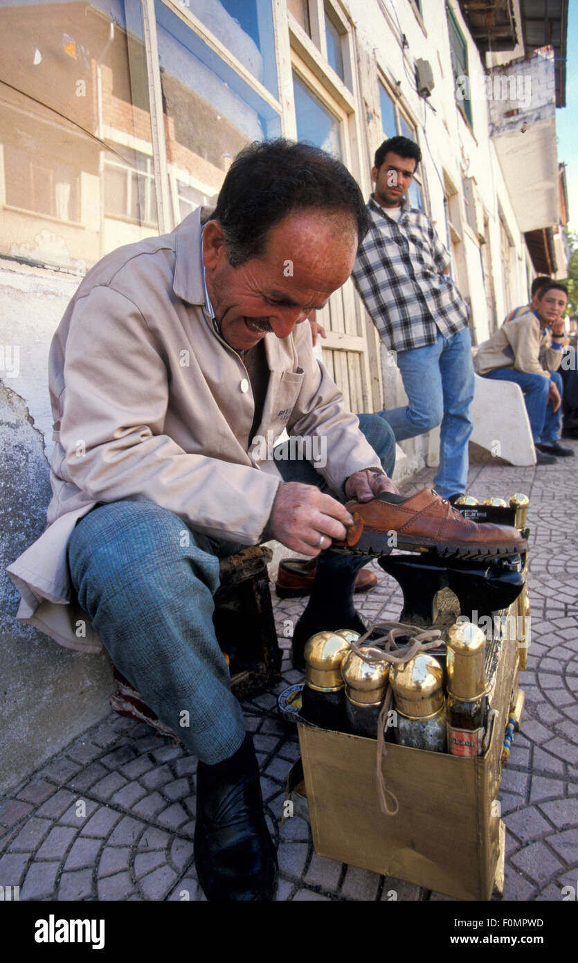 Shoe shine man in a street in Cevizli Akseki Turkey Stock Photo - Alamy