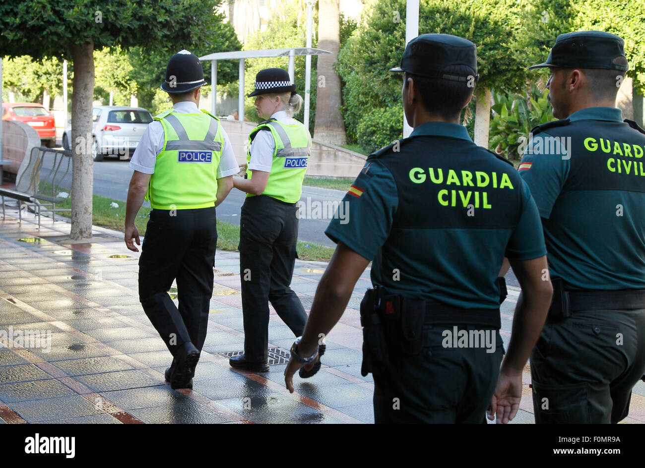 British officers in collaboration with spanish police patrol the ...