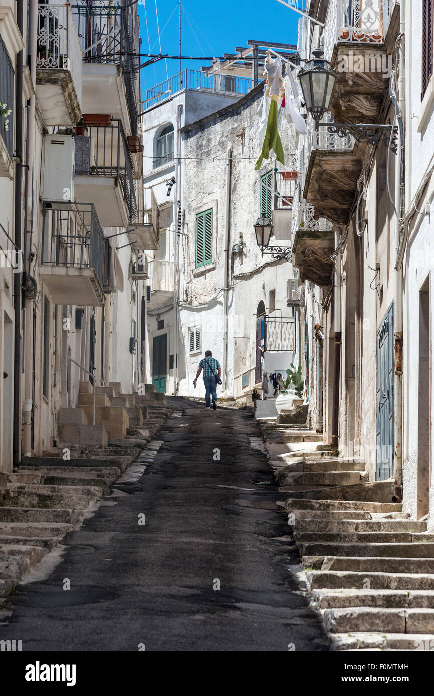 The steep and narrow side streets of Ostuni, Puglia, Italy Stock Photo ...