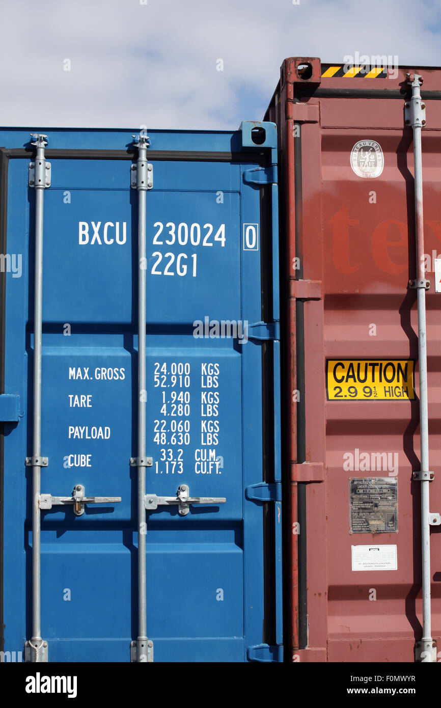 Oversized red cargo container locked Stock Photo - Alamy