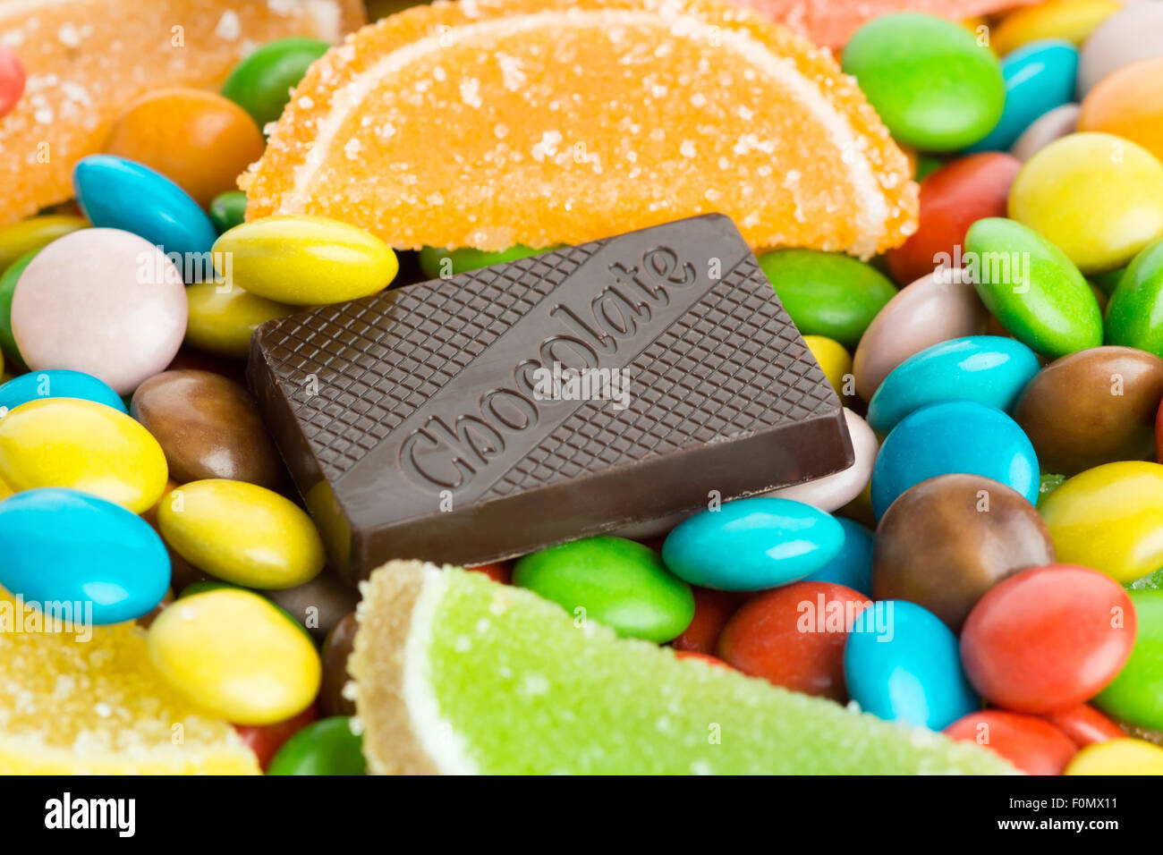 Mixed colorful sweets background Stock Photo - Alamy