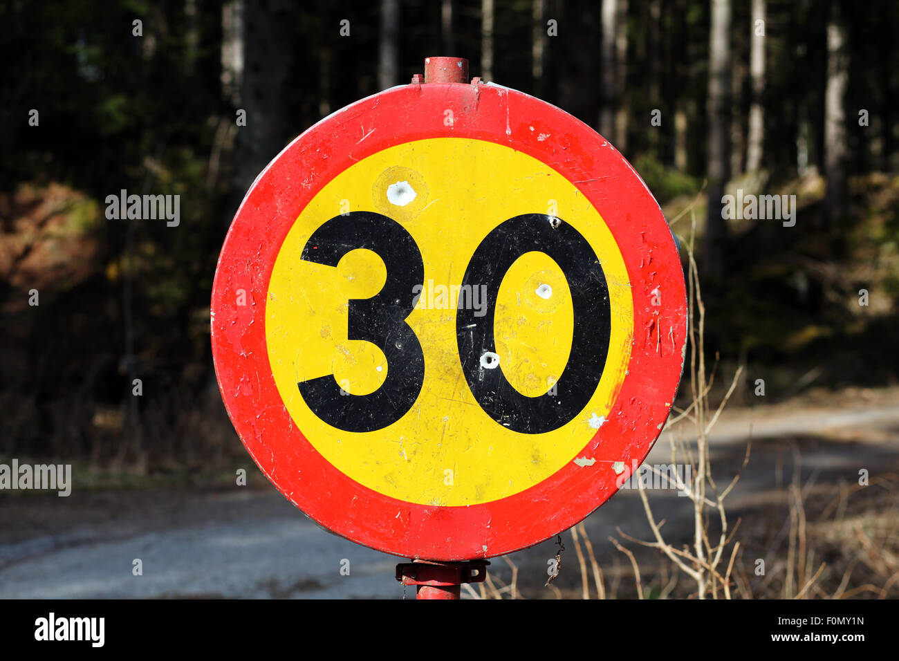 Sweedish bullet holed speed limit sign. Max 30 Stock Photo - Alamy
