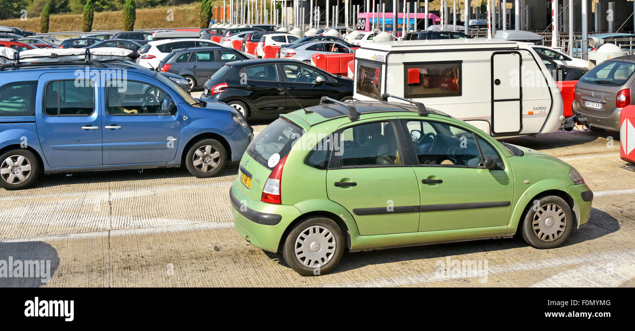 Cars queuing at busy French motorway toll booths in Provence South of ...
