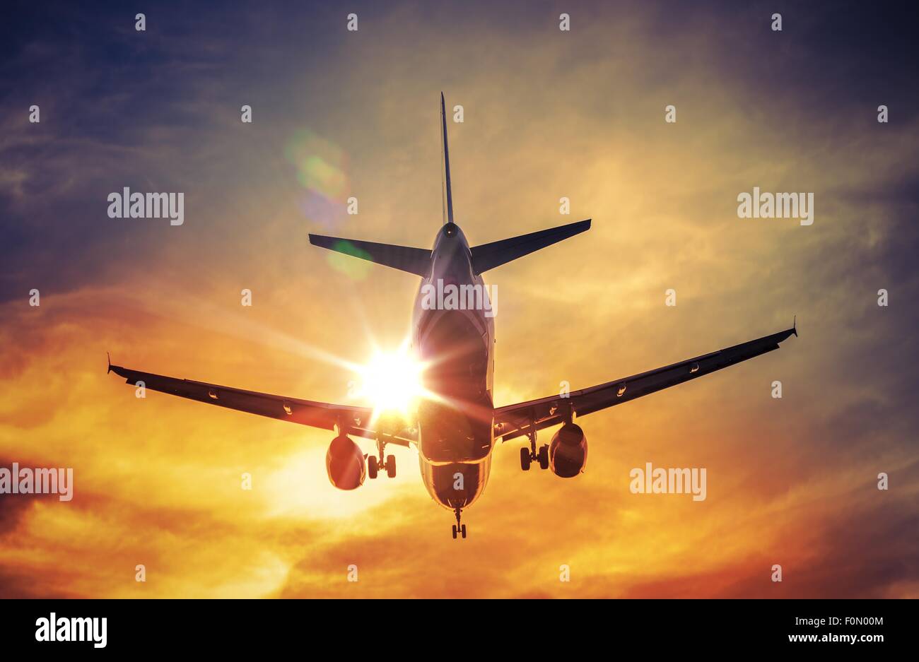 Landing Airplane and the Sun. Air Travel and Transportation Photography ...