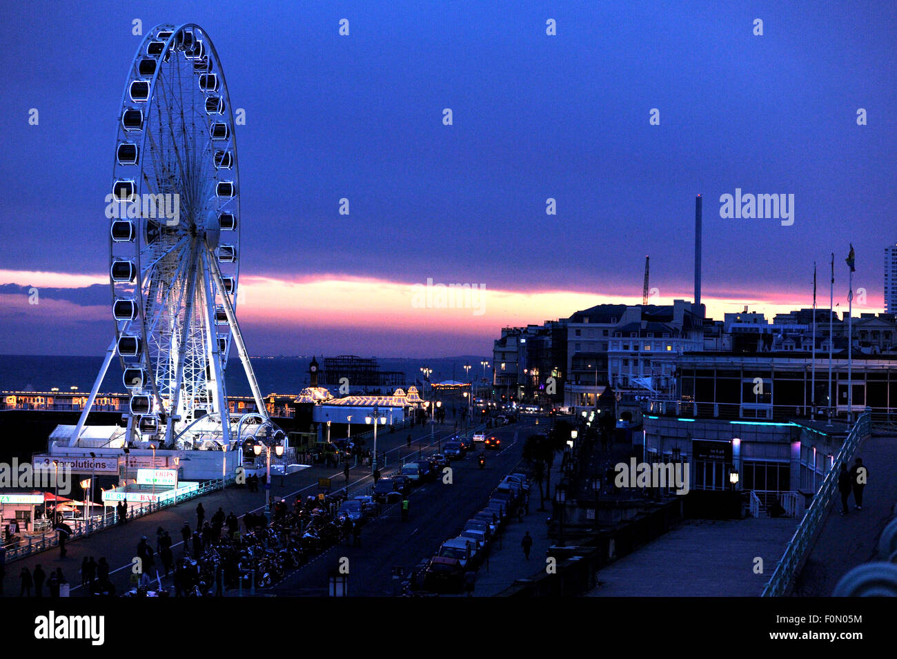 Brighton, UK. 18th August, 2015. A bright sunset drops behind the ...