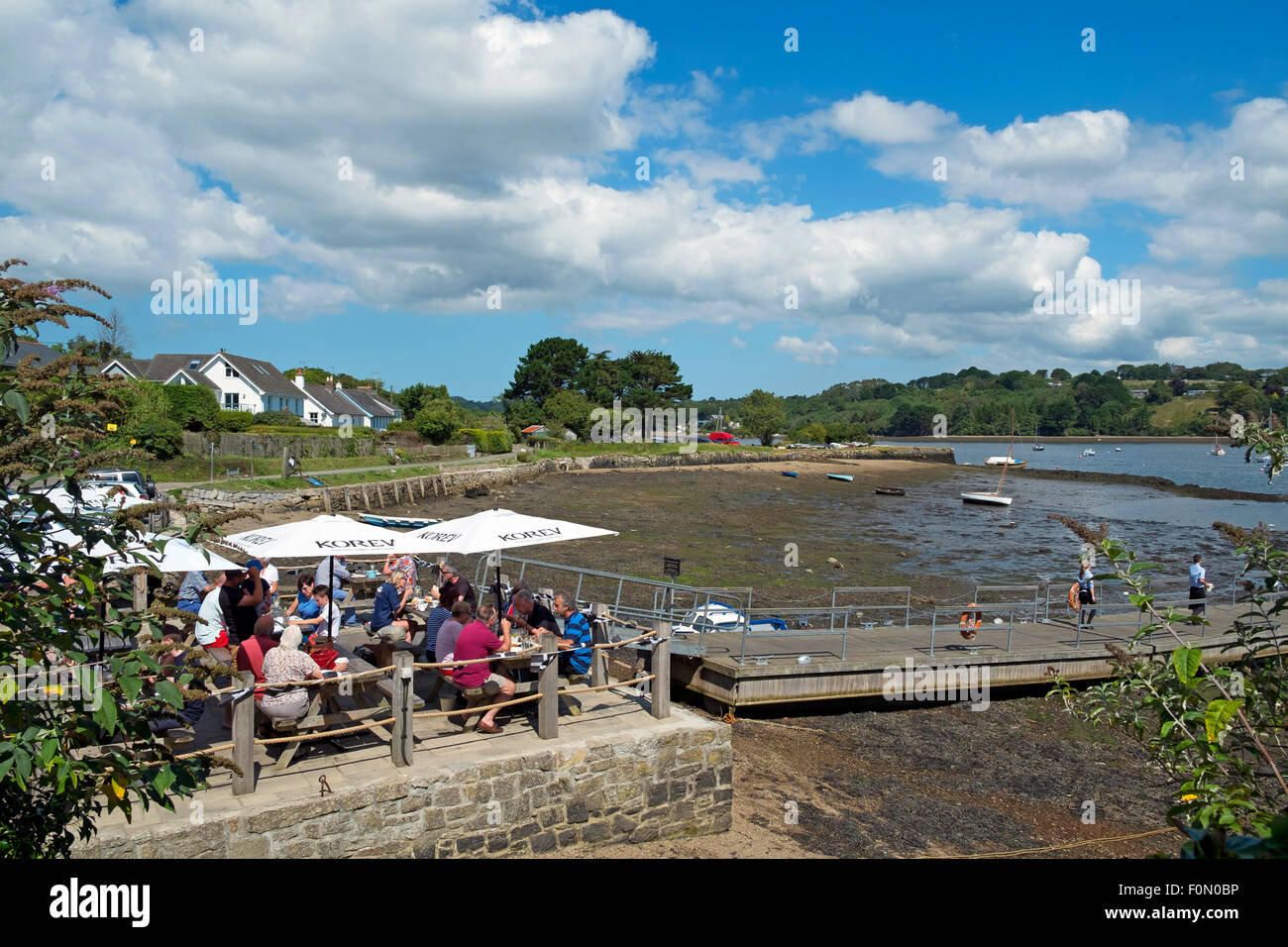 People dining outside of the Pandora Inn on Restronguet Creek near ...