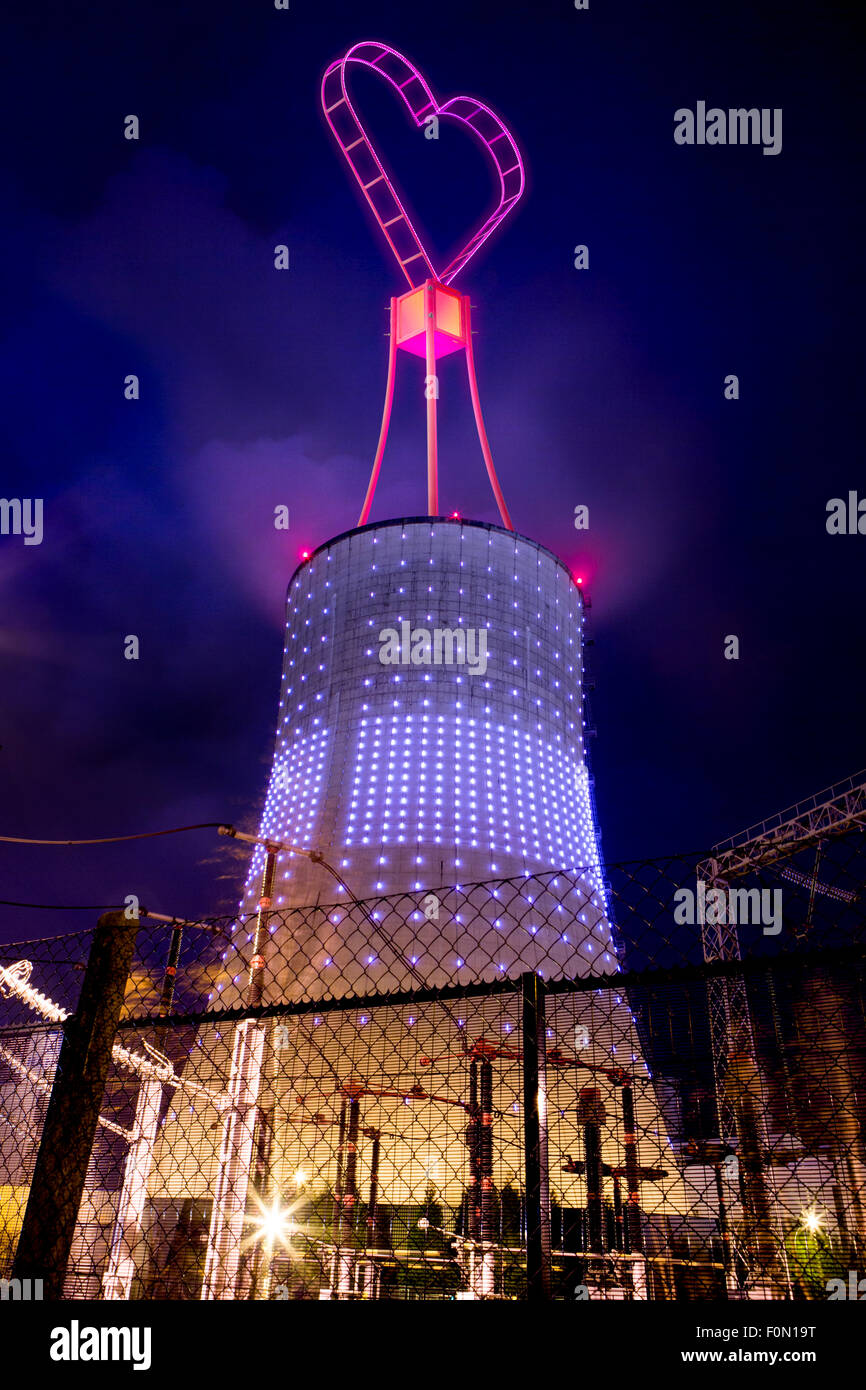 Illustration of a power plant with an illuminated love shape sign on ...