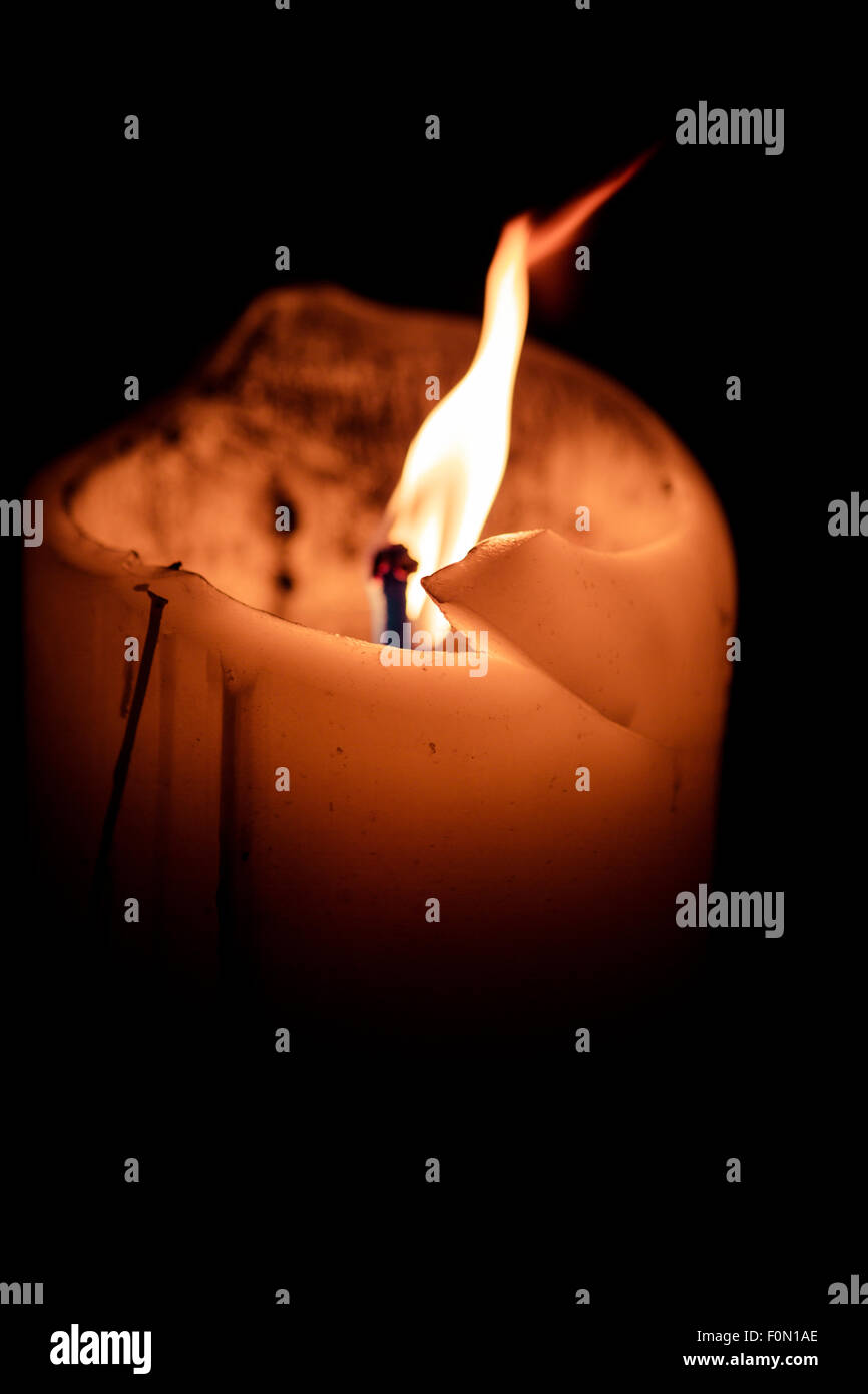 One candle flame at night closeup - isolated, black background Stock ...