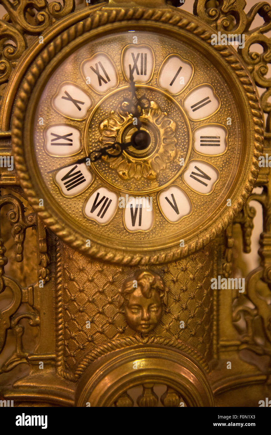 Classical old yellow iron clock made in nineteenth century Stock Photo ...