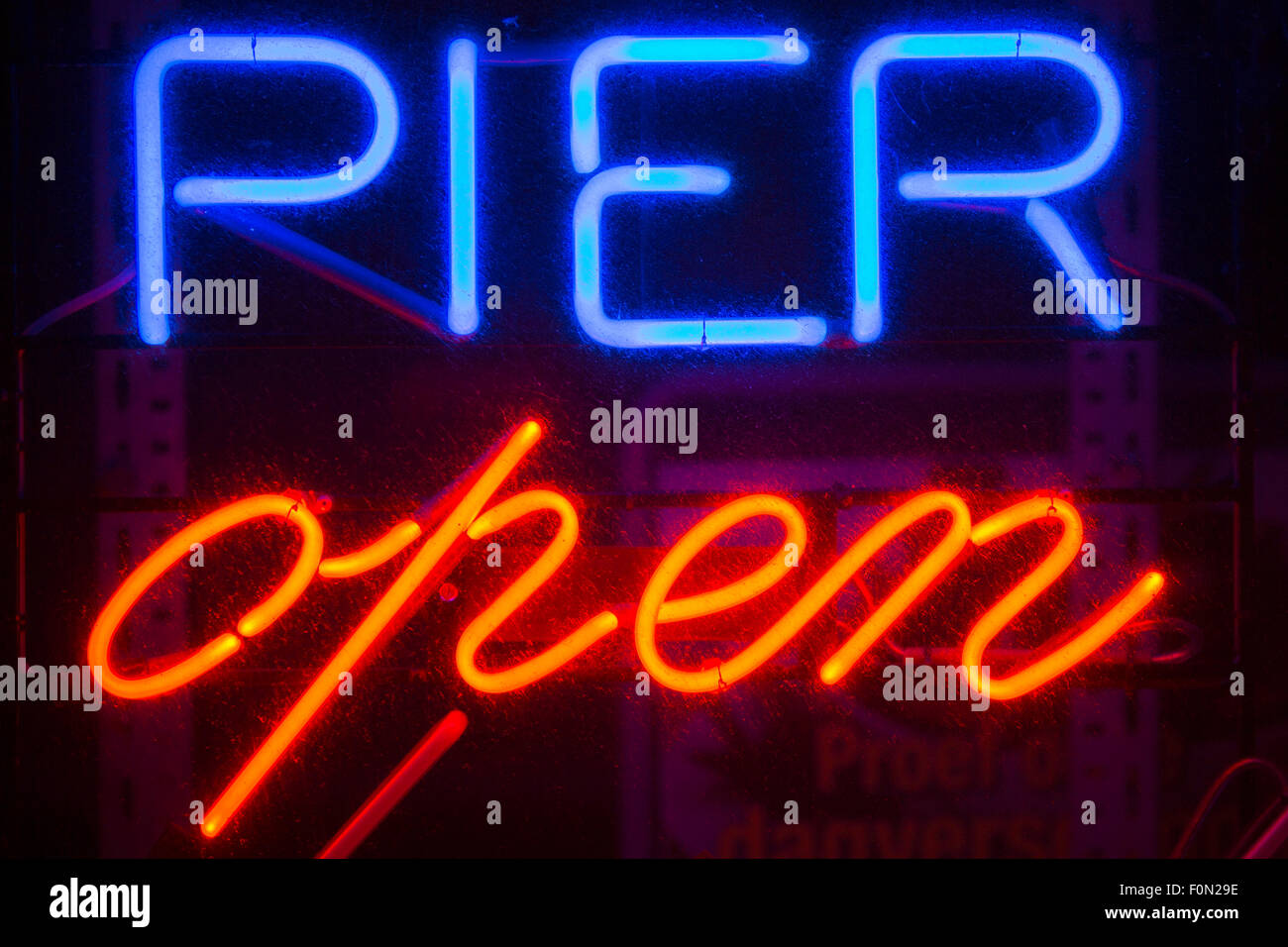 A blue and red Pier Open sign at the entrance of a public Pier in ...