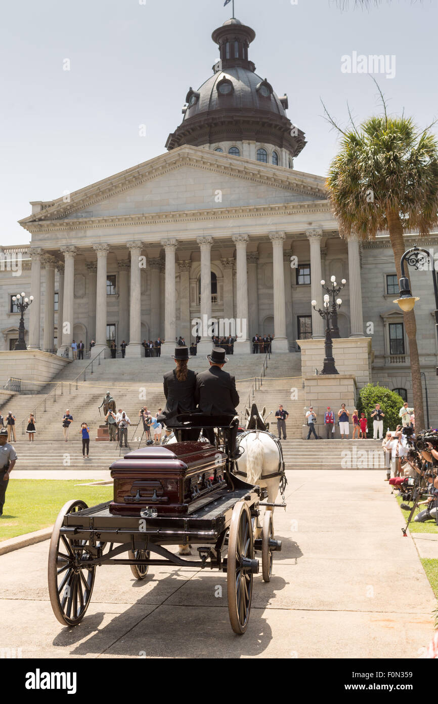 The horse-drawn caisson carrying the casket of slain State Senator ...