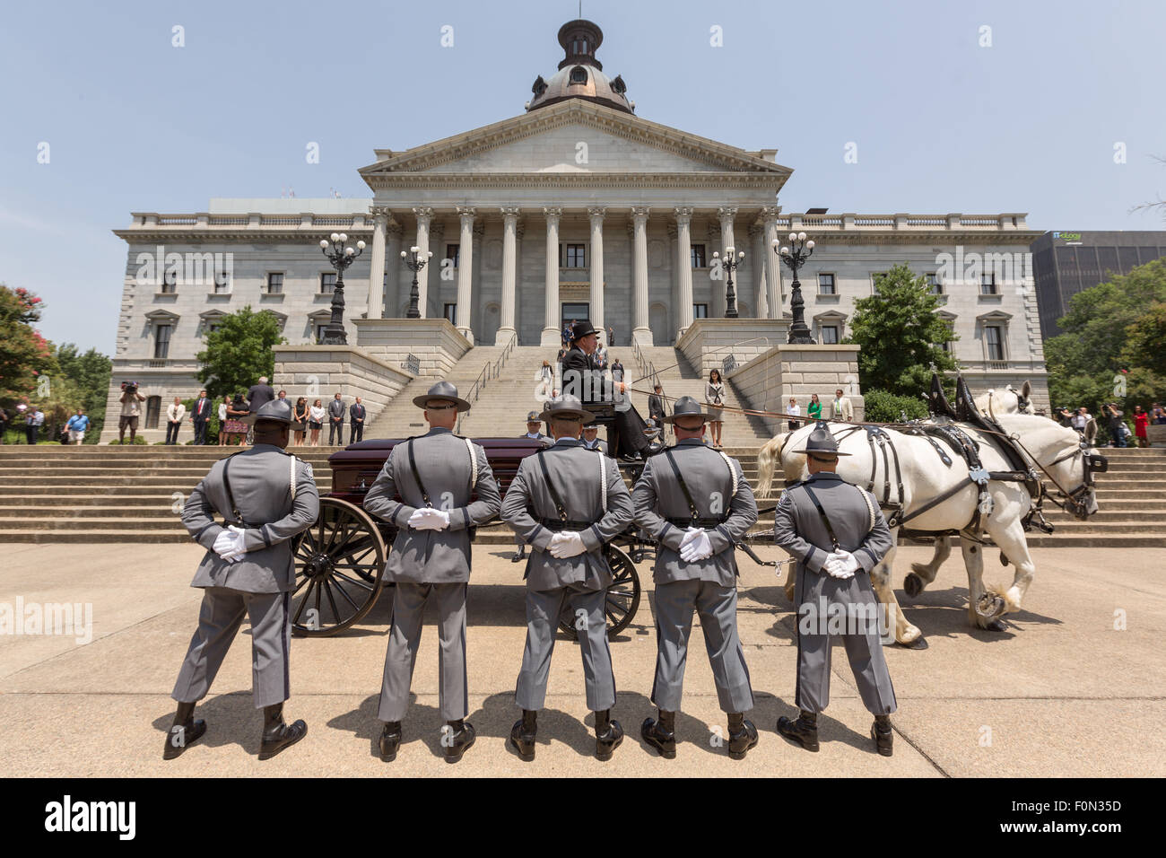 The horse-drawn caisson carrying the casket of slain State Senator ...