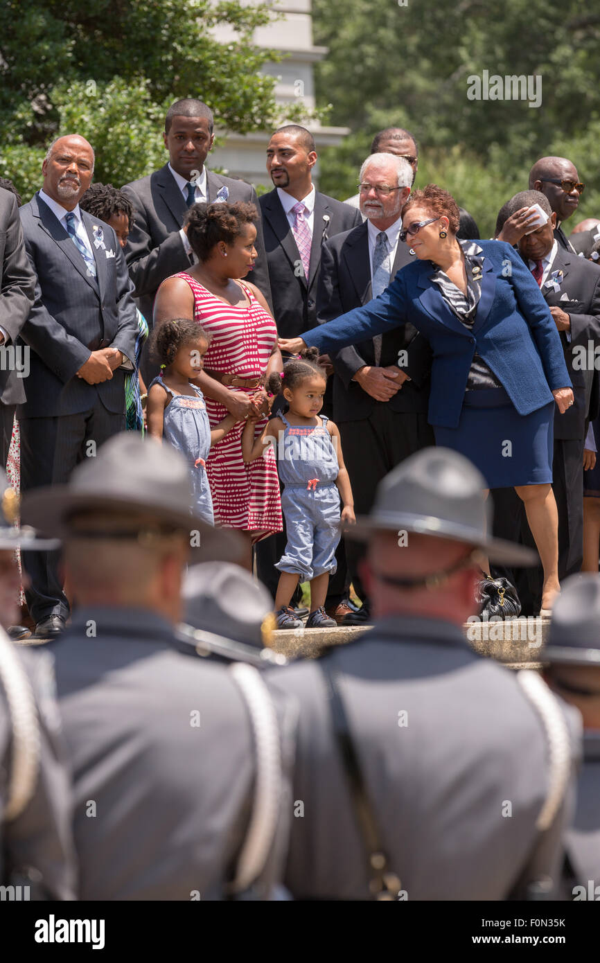 Family members are comforted as the casket of slain State Senator ...