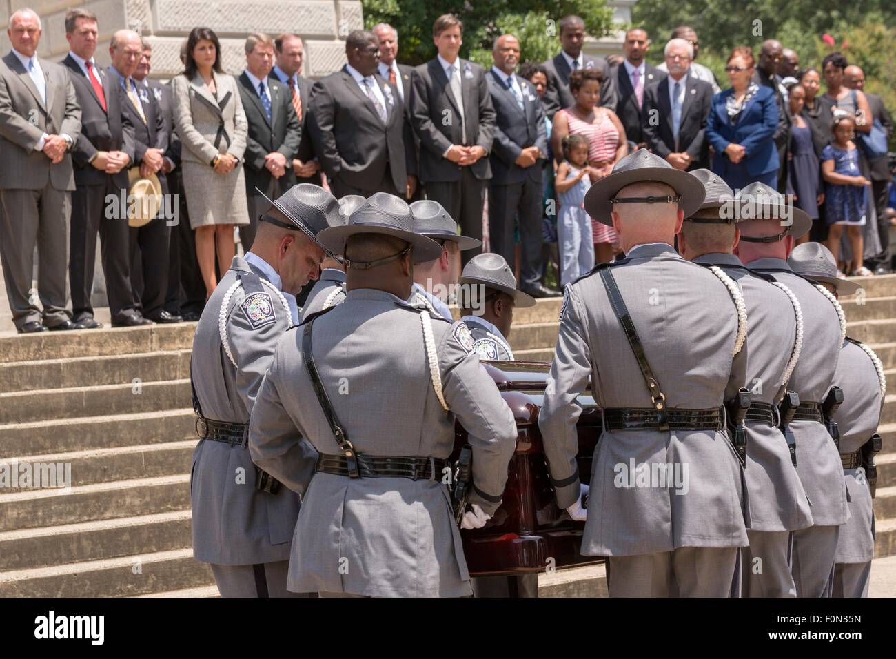 Police honor guard removes the casket of slain State Senator Clementa ...