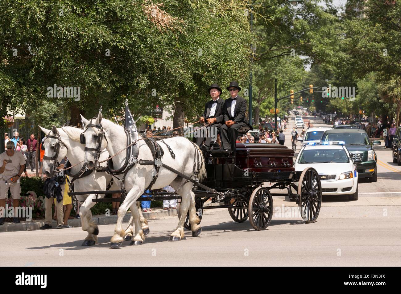 The horse-drawn caisson carrying the casket of slain State Senator ...
