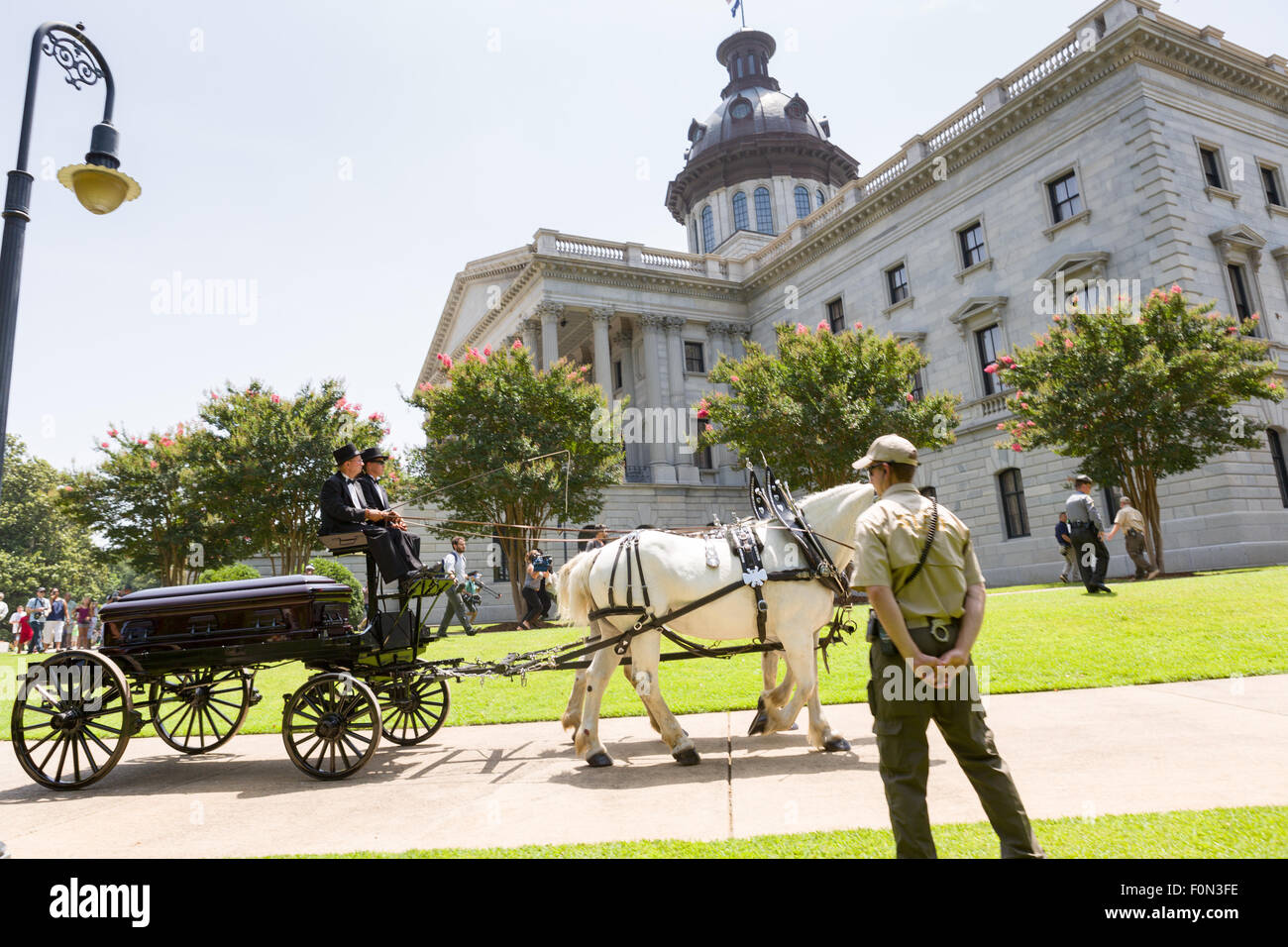 The horse-drawn caisson carrying the casket of slain State Senator ...