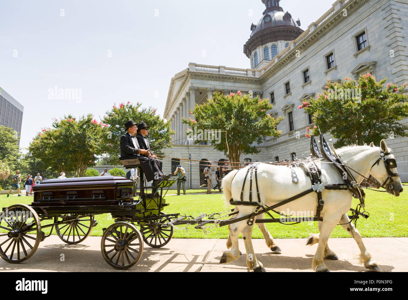 The horse-drawn caisson carrying the casket of slain State Senator ...