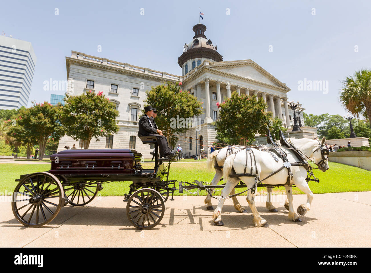 The horse-drawn caisson carrying the casket of slain State Senator ...