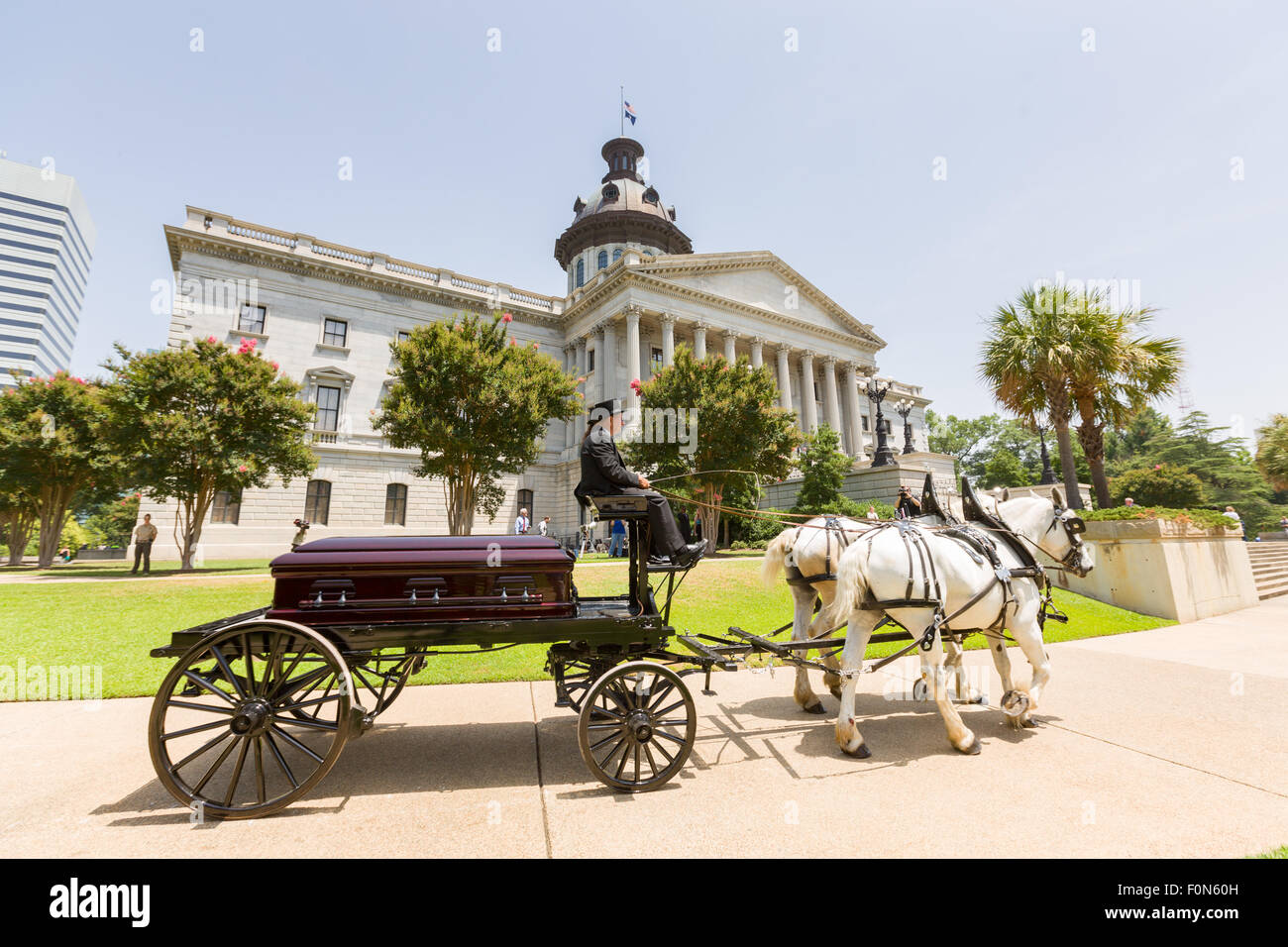 The horse-drawn caisson carrying the casket of slain State Senator ...