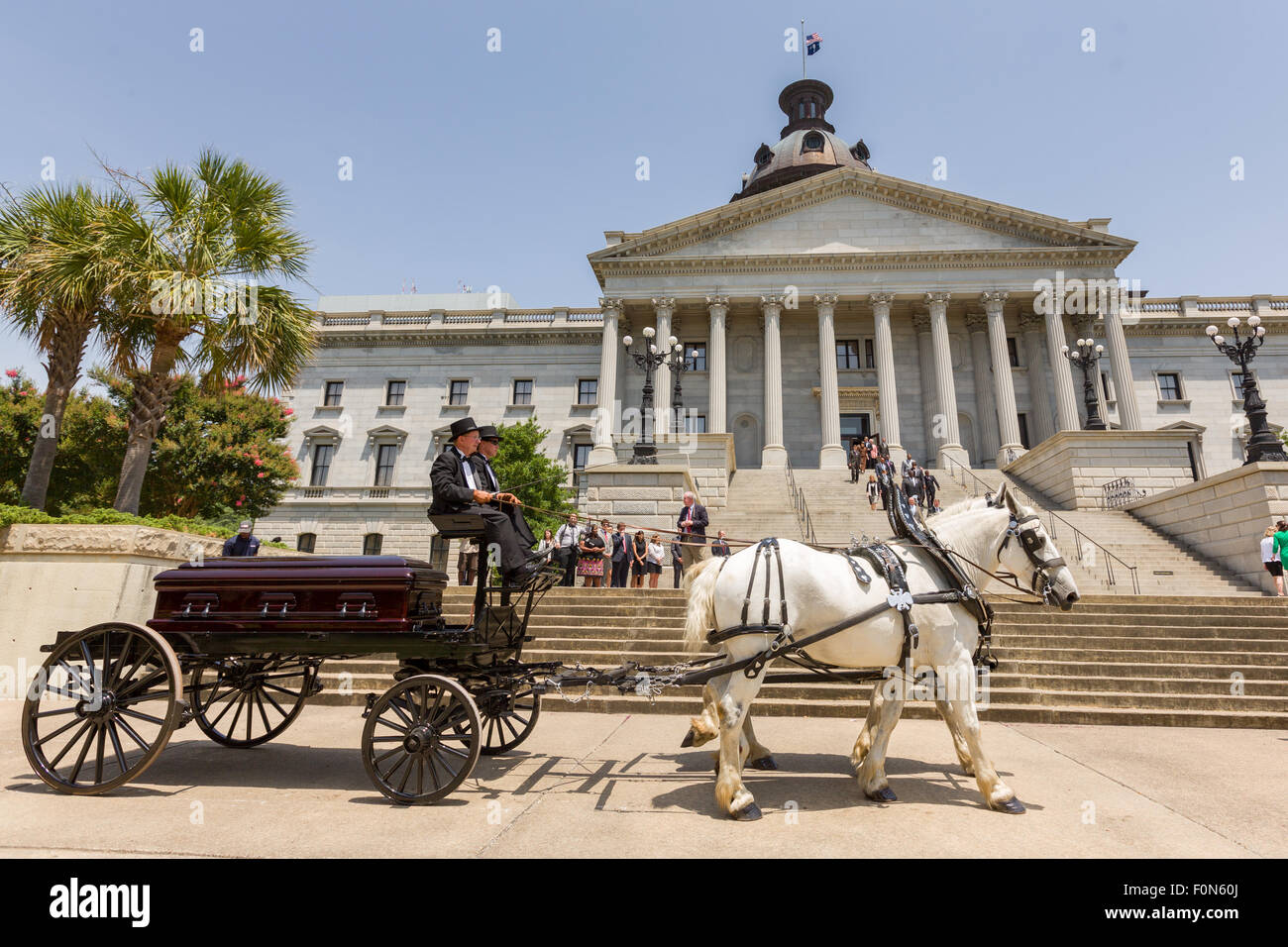 The horse-drawn caisson carrying the casket of slain State Senator ...
