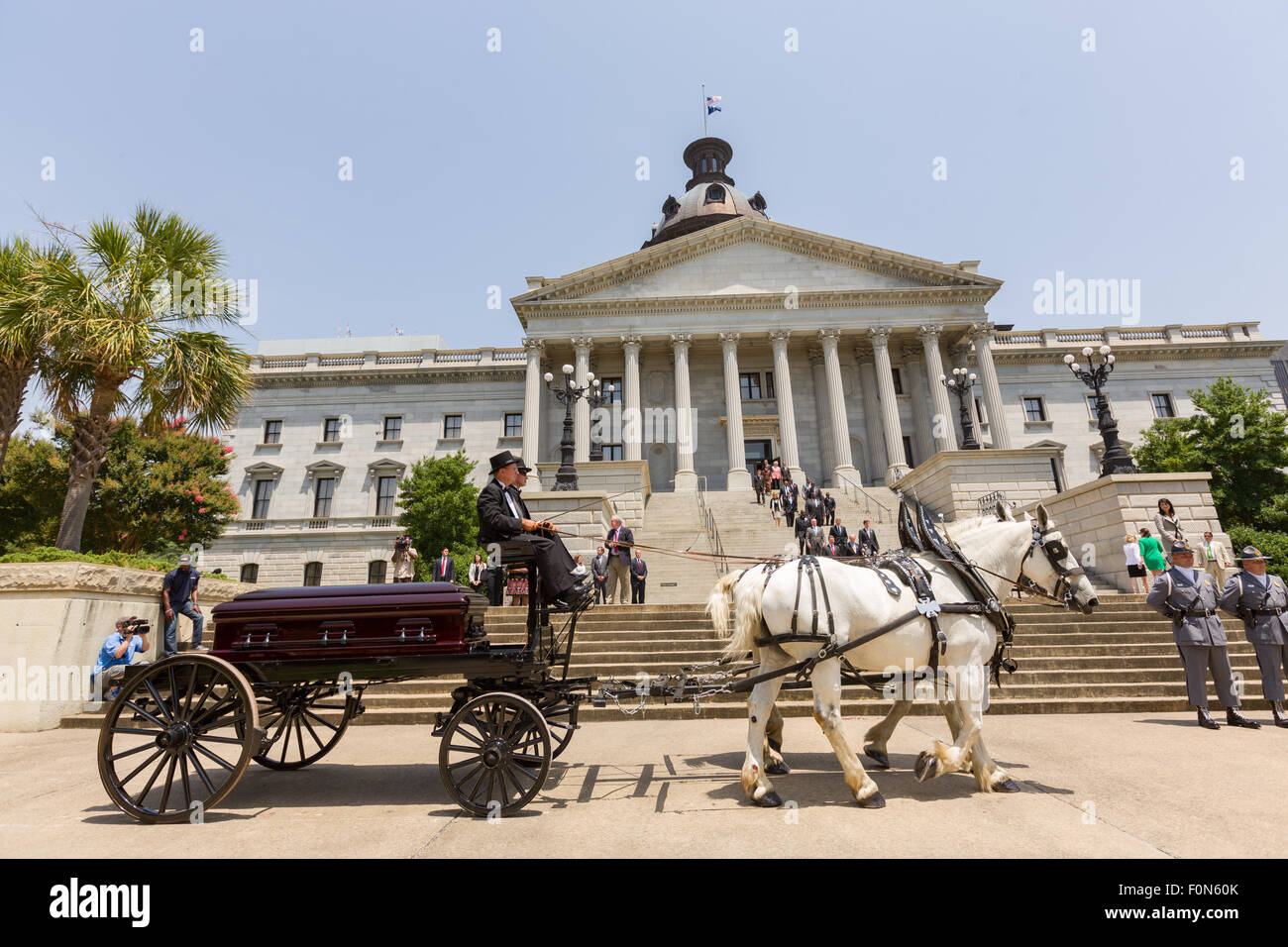 The horse-drawn caisson carrying the casket of slain State Senator ...