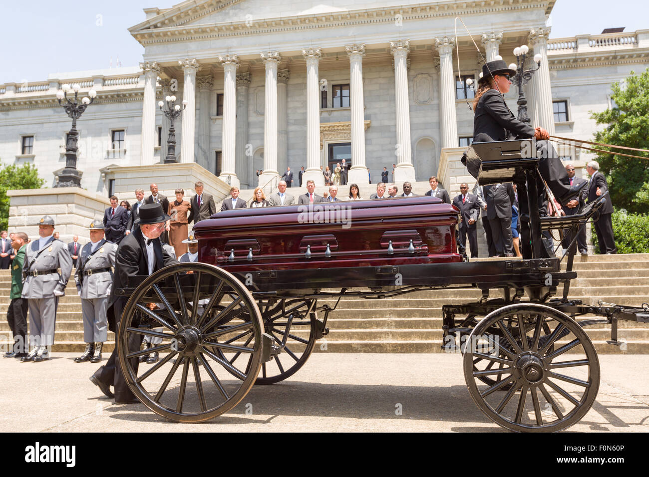 The horse-drawn caisson carrying the casket of slain State Senator ...