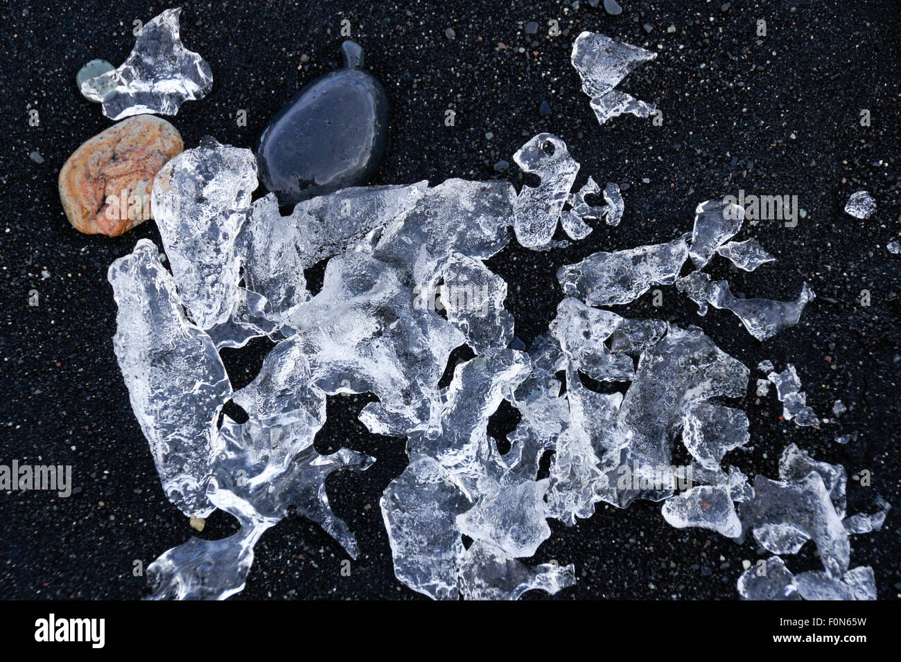 Glacial ice washed up on black sand beach at Jokulsarlon, southern ...