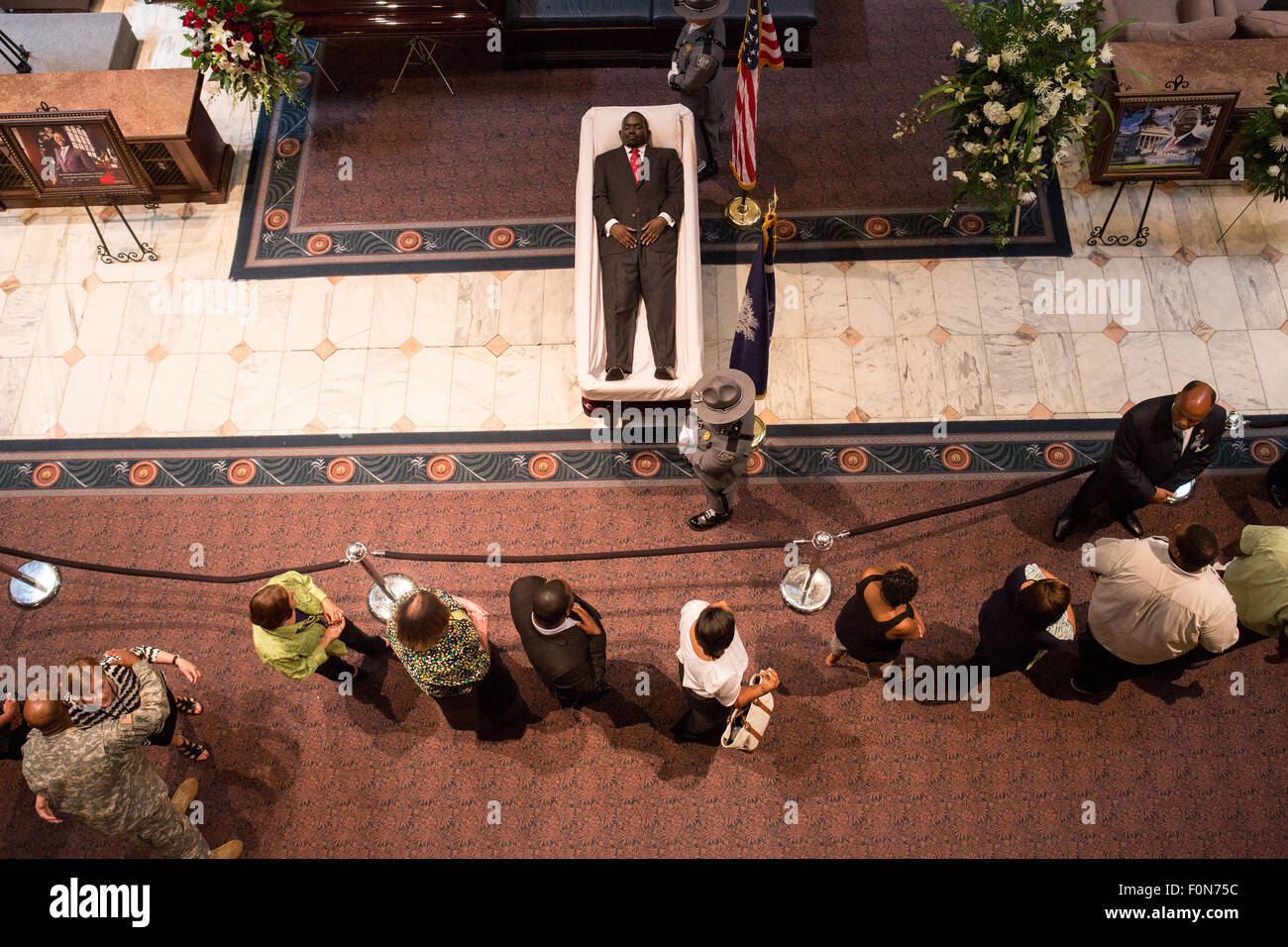 Mourners pause to view the body of slain State Senator Clementa ...